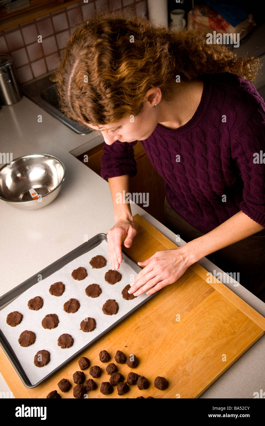attractive young woman baking cookies Stock Photo - Alamy