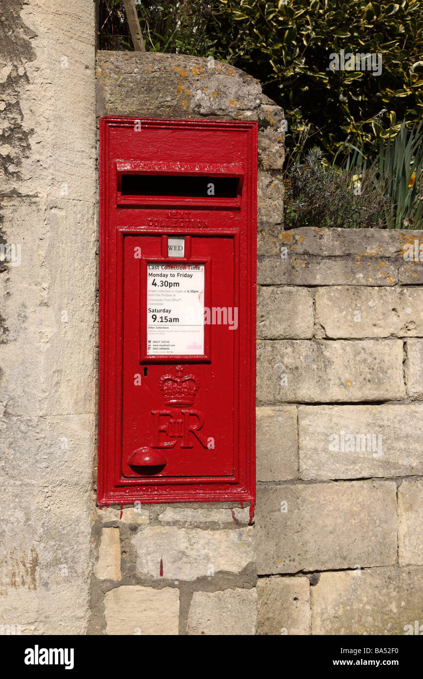 Close up of a red Post box set in the wall, Bibury, Gloucestershire, UK ...