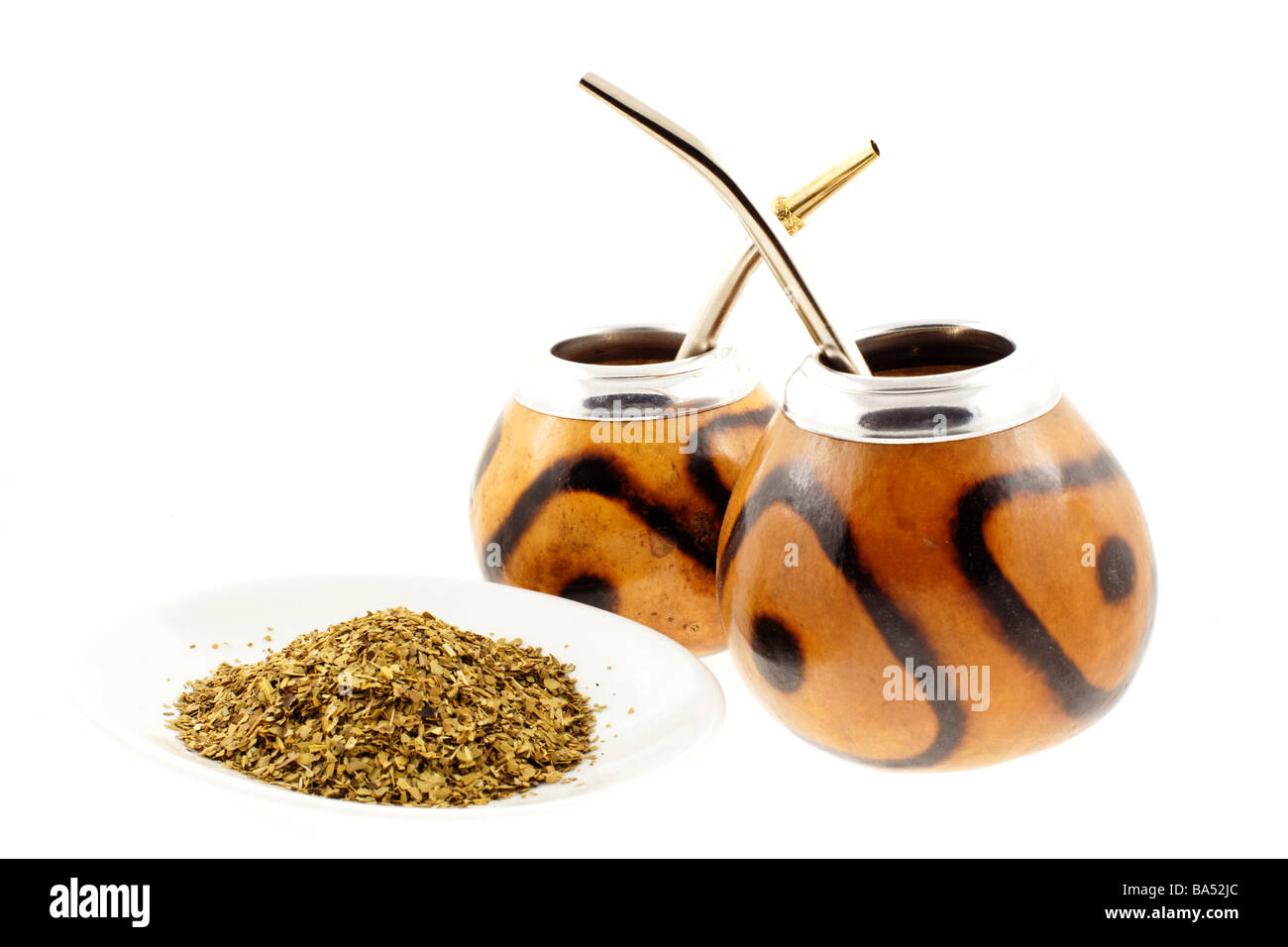 couple of mate cups on and a plate with mate a white background Stock ...