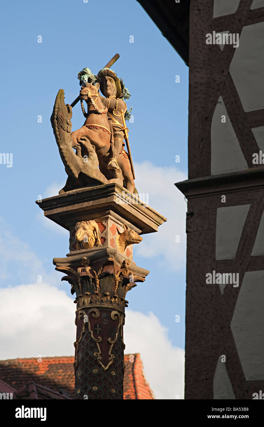 Statue above fountain of St George slaying the dragon Rothenburg ob der ...