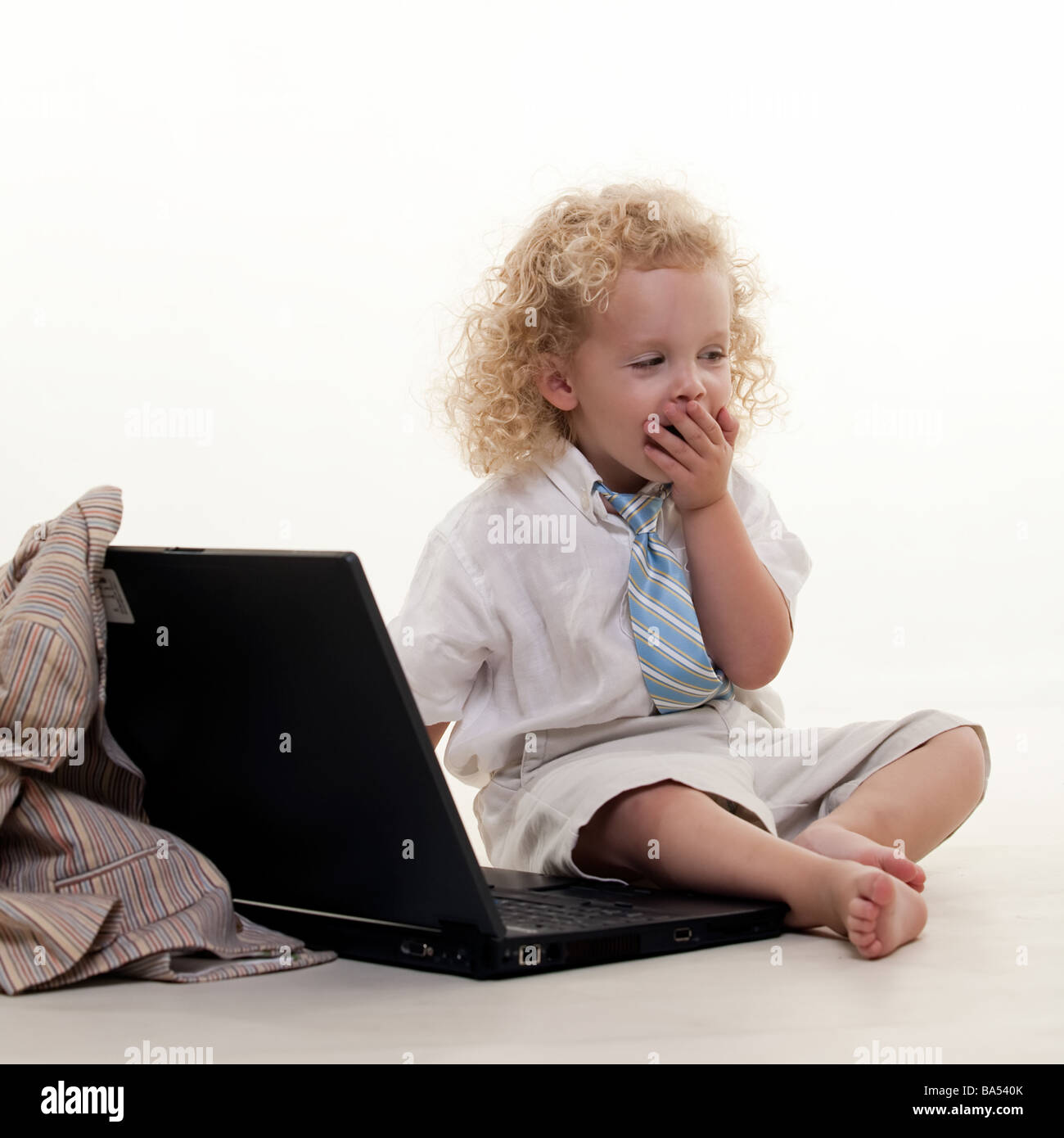 Tired little business man Stock Photo - Alamy