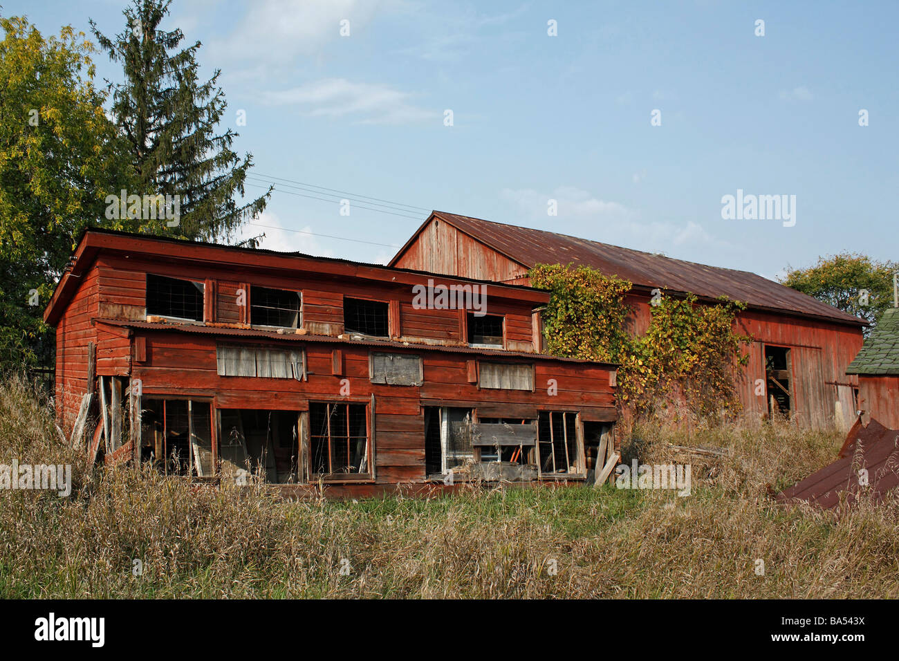 Abandoned wrecked red wooden barn with farm in Michigan MI USA Stock ...