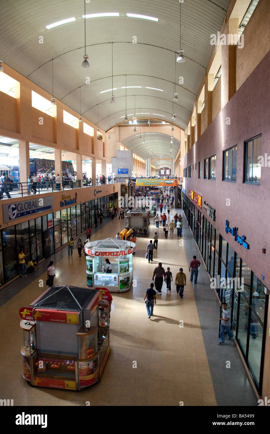 Shops and shopping kiosks in Panama City Bus Station. Buses arrive on a ...
