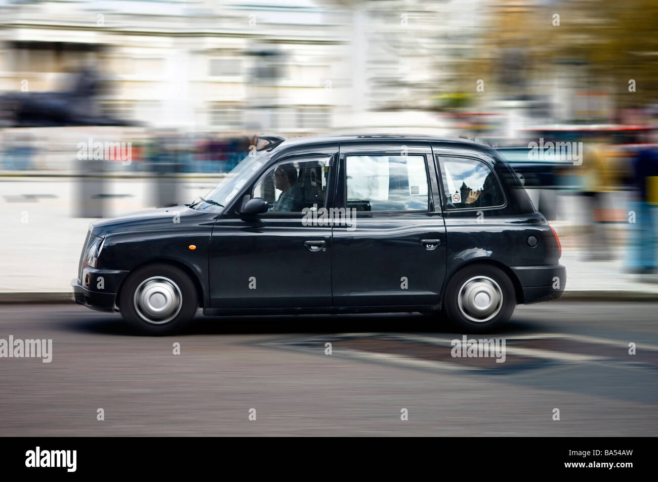 Black cab in motion London England UK Stock Photo - Alamy