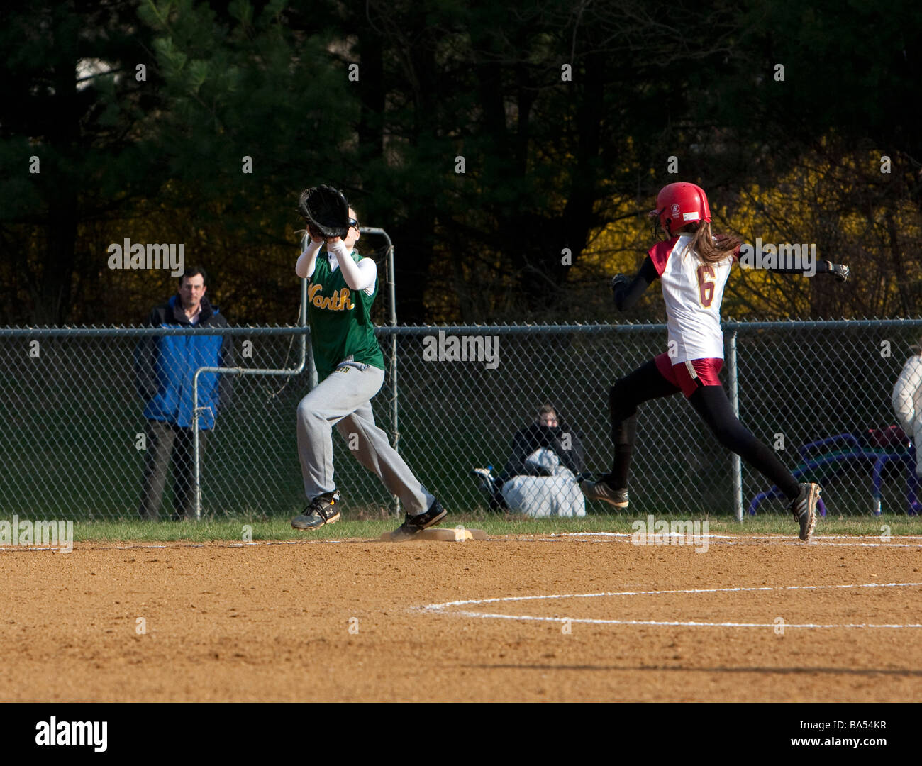 A girls high school softball game Stock Photo - Alamy