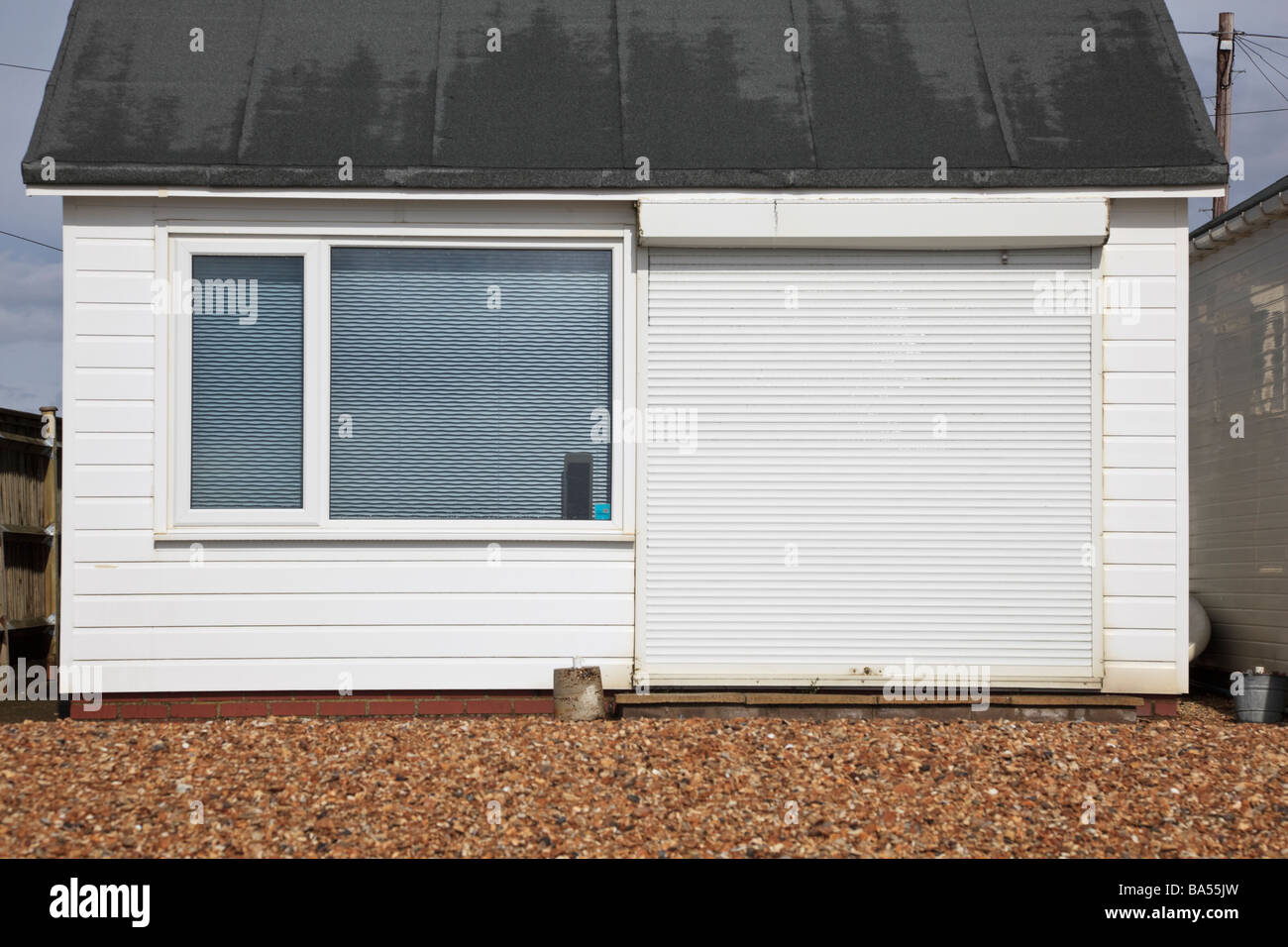 White Beach Hut with horizontal lines on shutter and blinds Southampton ...