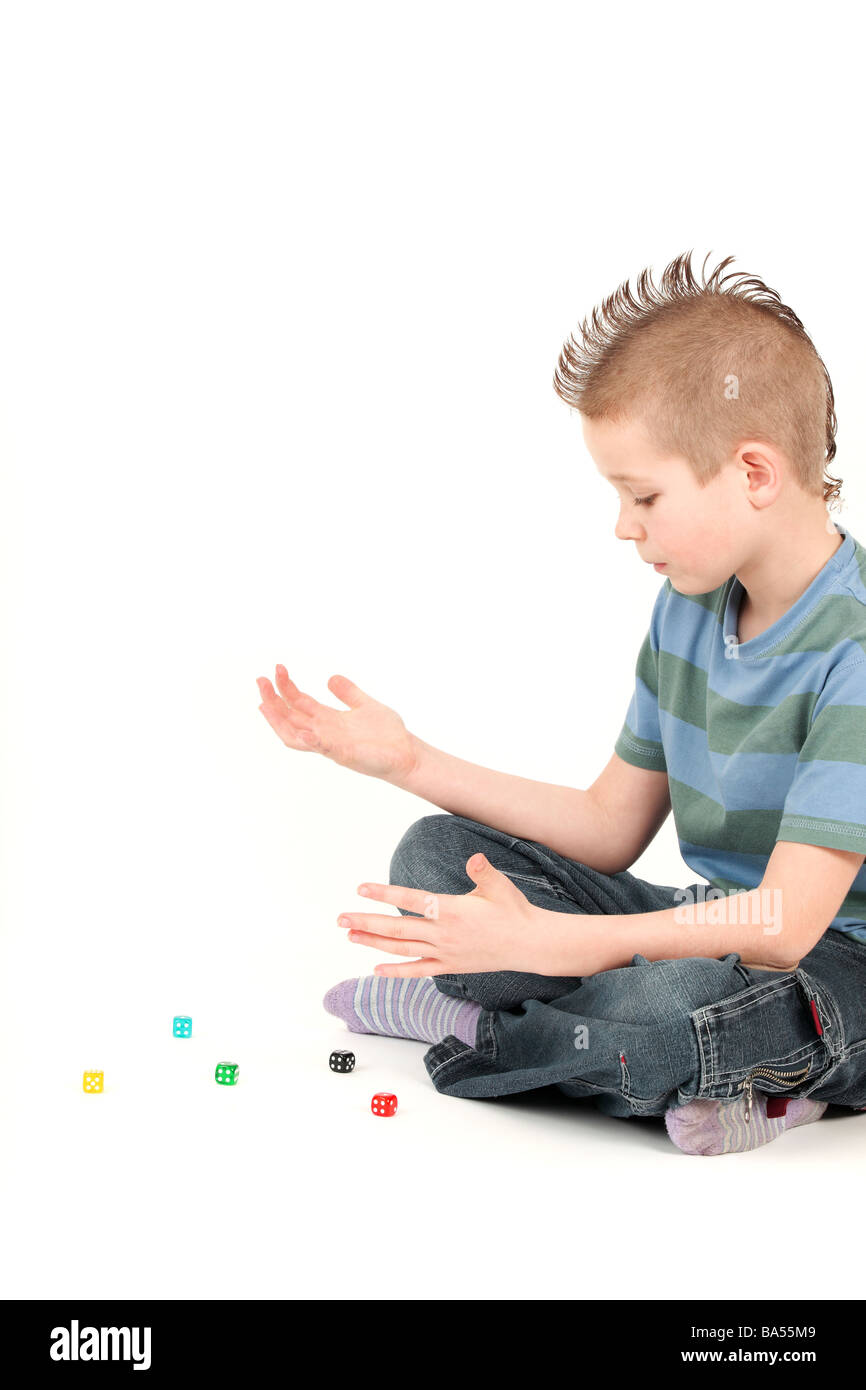 Child rolling dice hi-res stock photography and images - Alamy