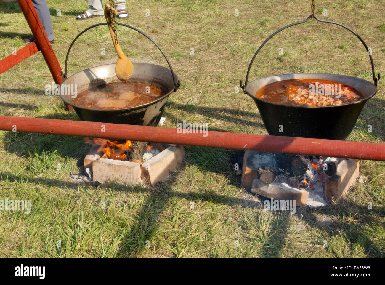 Cauldrons of stew cooking outdoors at summer festival in Hungary Stock ...