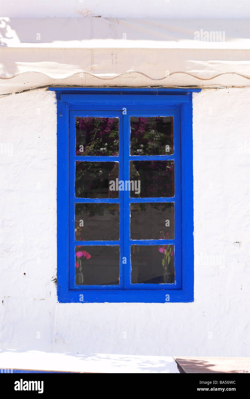 A blue window frame on a white painted house on Hydra, Greece Stock ...