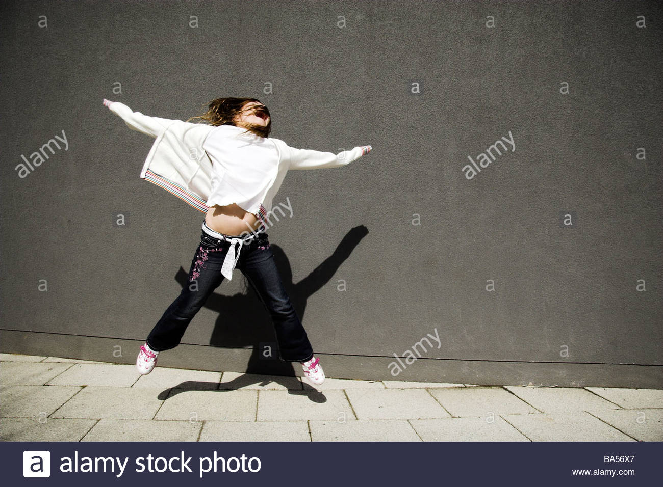 Positive Girl Jumping High Resolution Stock Photography and Images - Alamy
