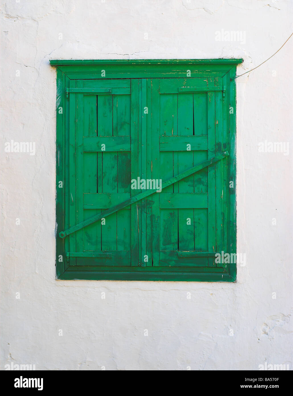 Green shuttered window on a white painted house, Hydra Greece Stock ...