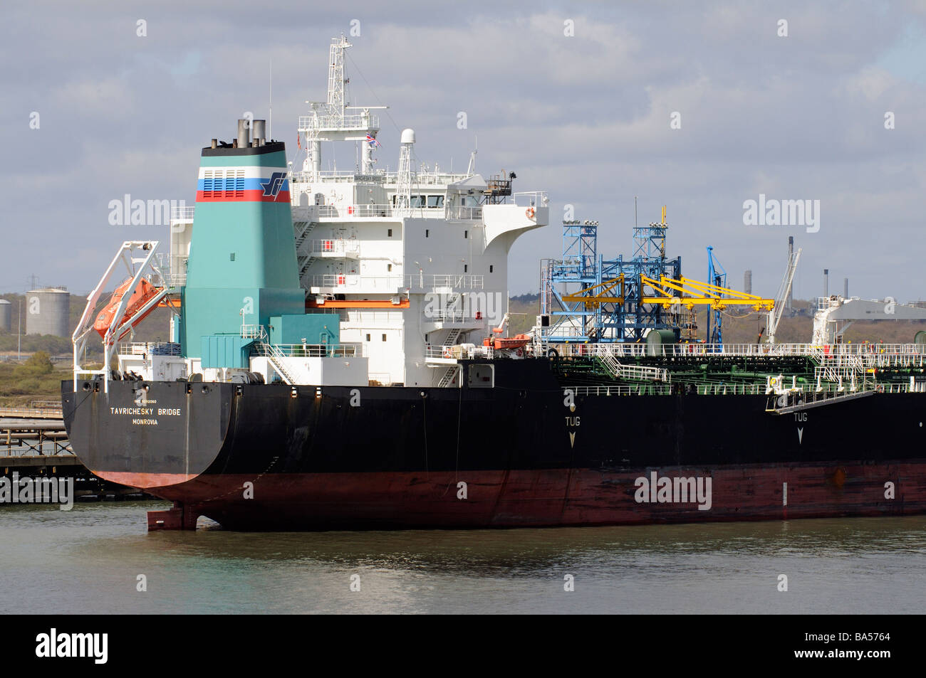 Tanker ships alongside at Fawley Refinery on Southampton Water southern ...