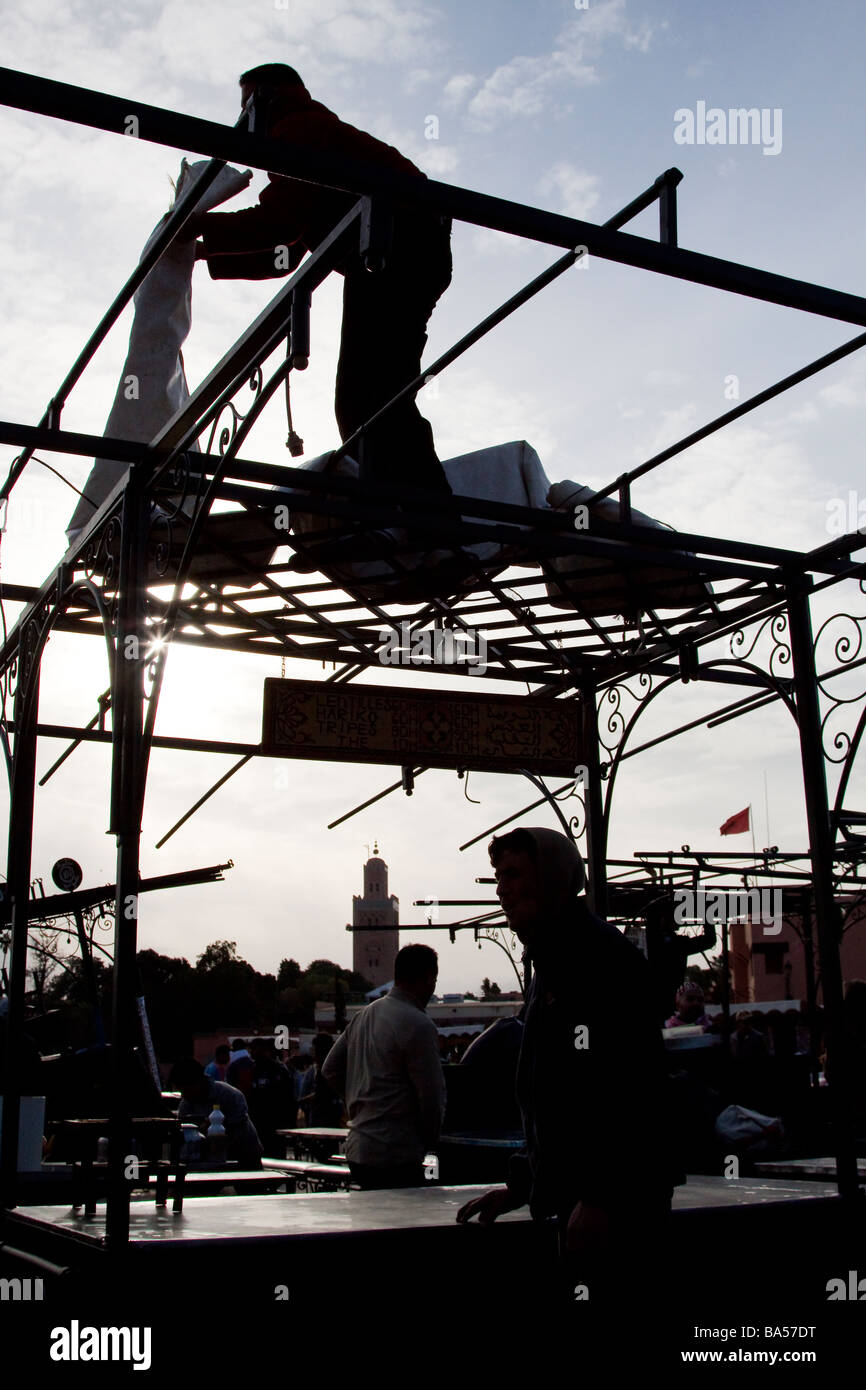 Stall holders construct the metal frames of their food stalls in ...