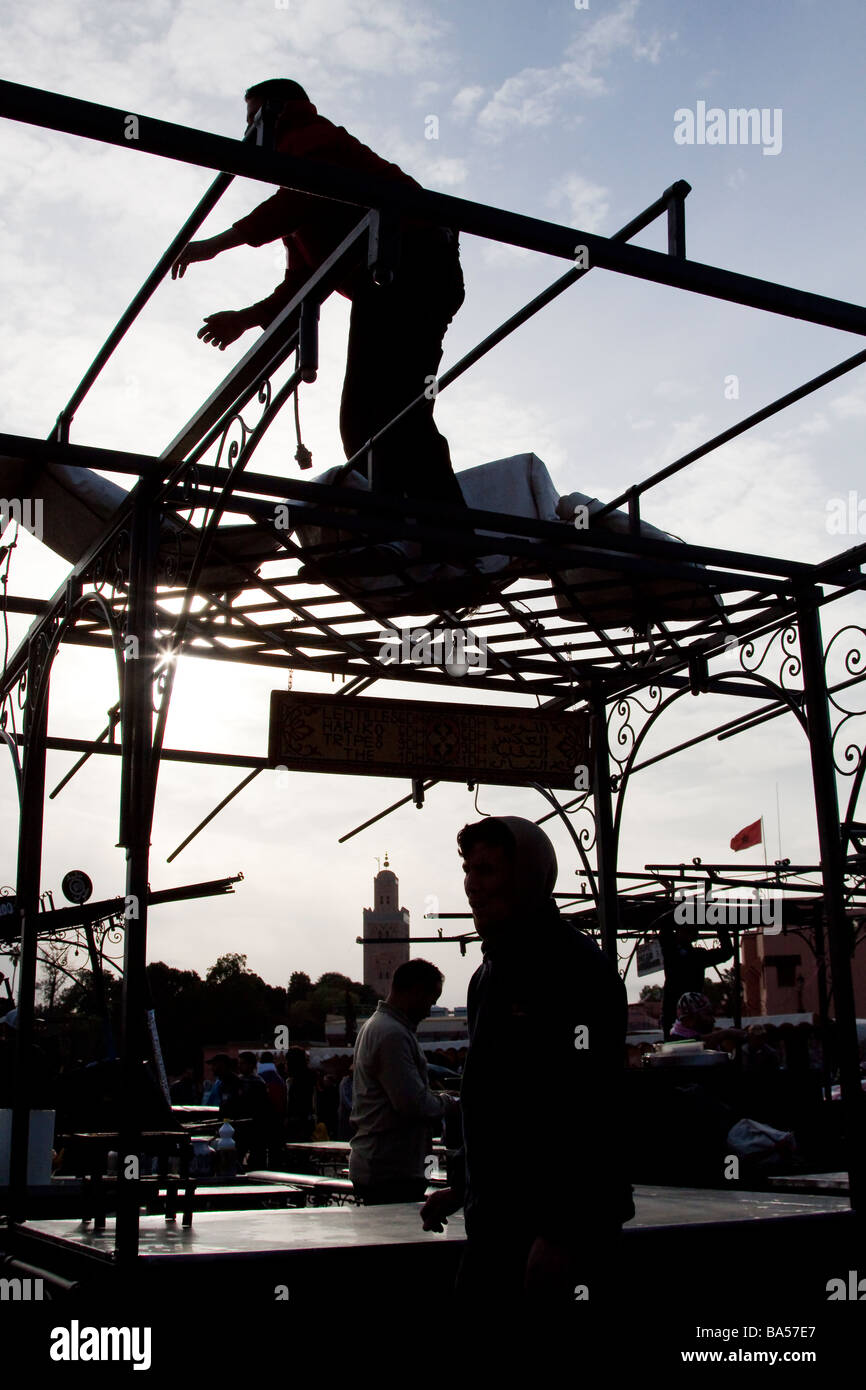 Stall holders construct the metal frames of their food stalls in ...