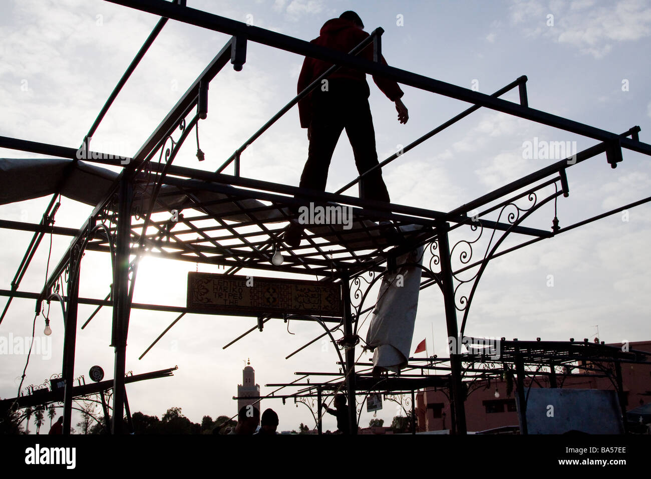 Stall holders construct the metal frames of their food stalls in ...