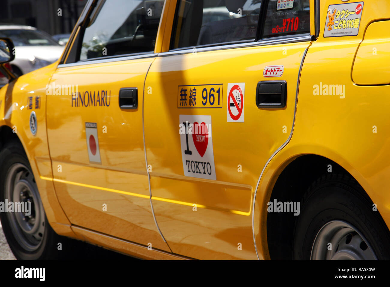 Yellow taxi cab in Tokyo Japan Stock Photo - Alamy