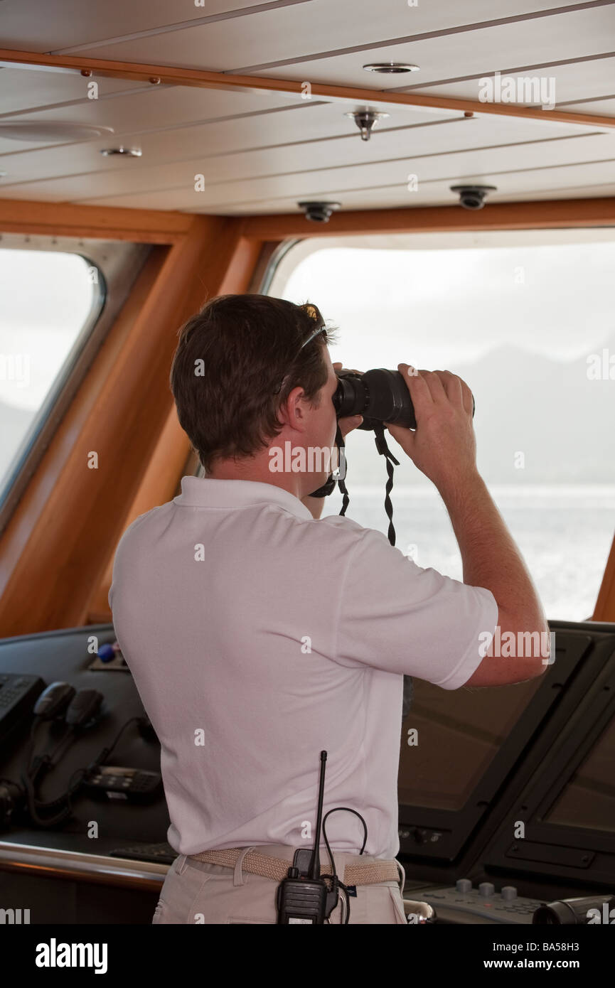 Captain on watch on the bridge aboard superyacht "Big Aron" keeping ...