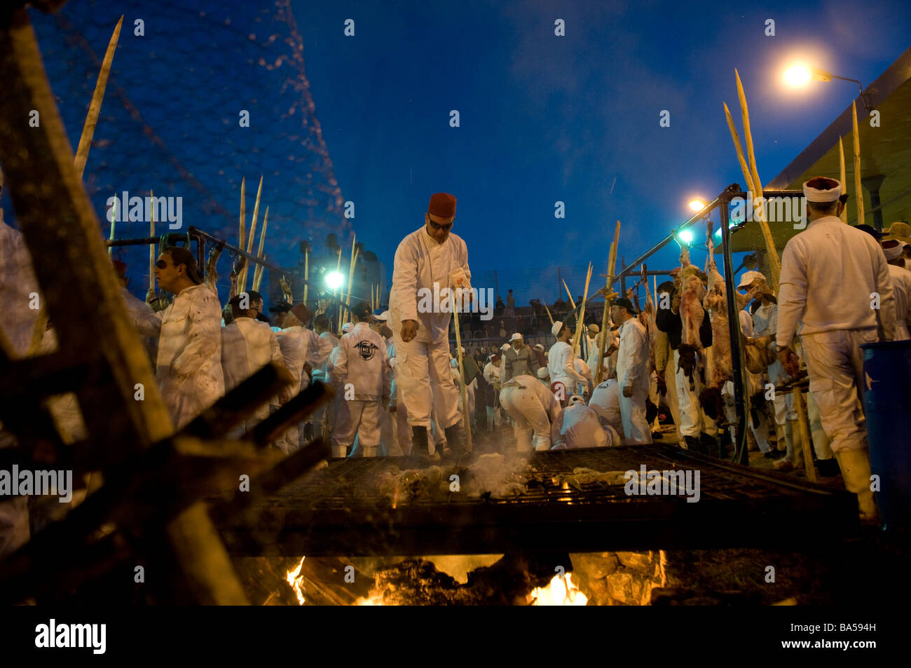 Members of the ancient Samaritan community placing sheep on stakes ...