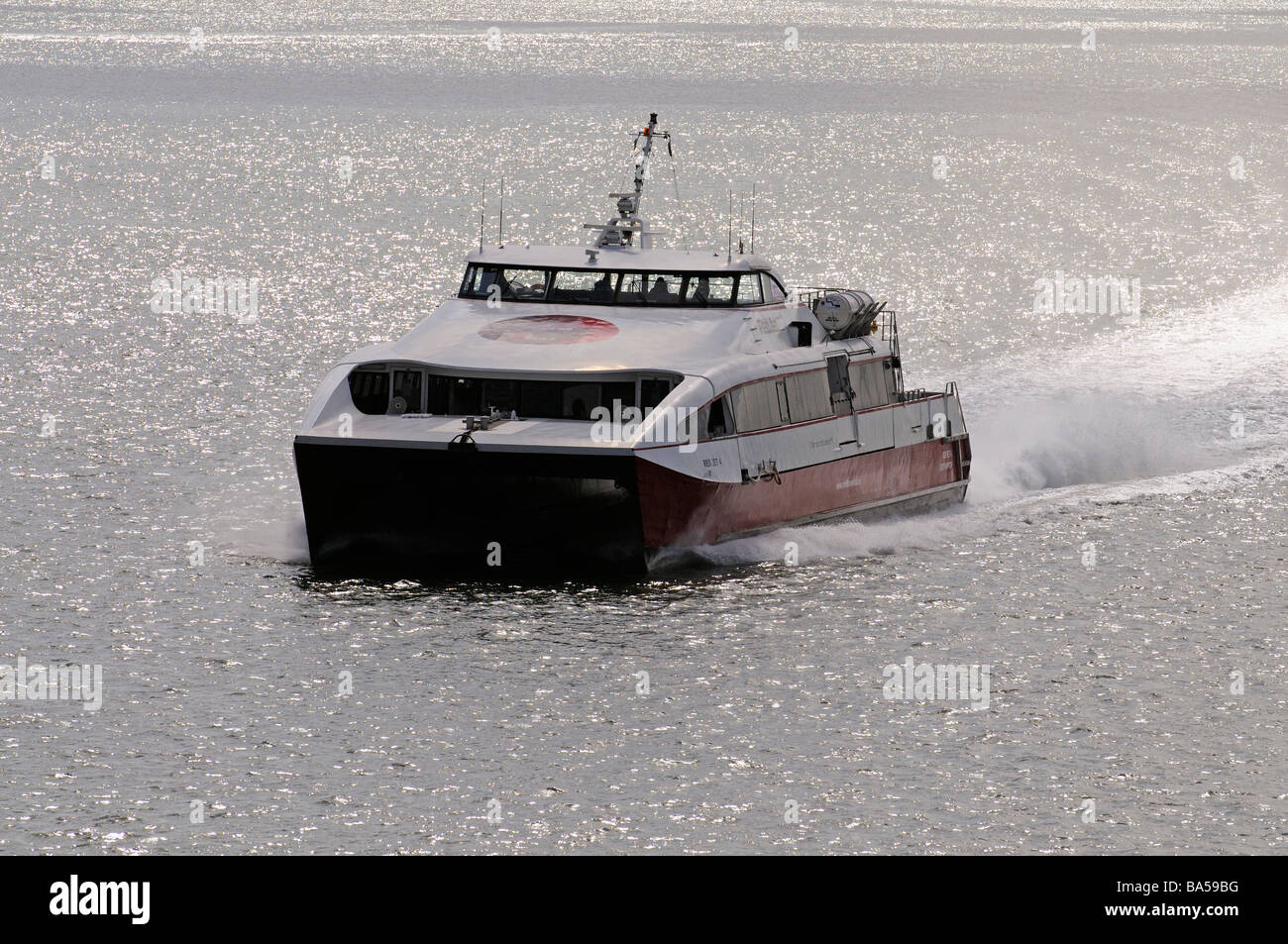 Travelling against the light Red Jet 4 a catamaran passenger ferry on ...