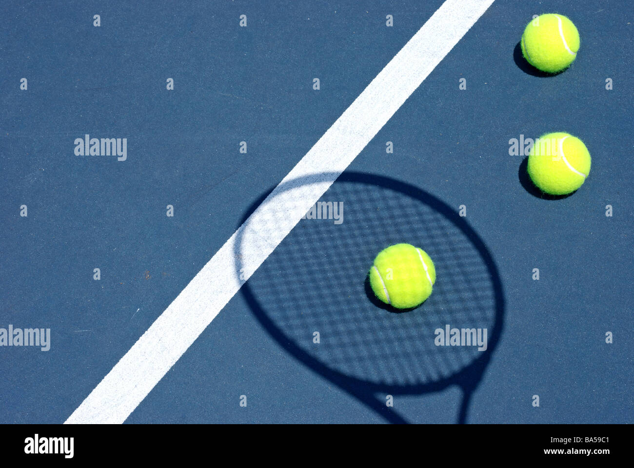 Tennis ball and racket on hard surface Stock Photo - Alamy
