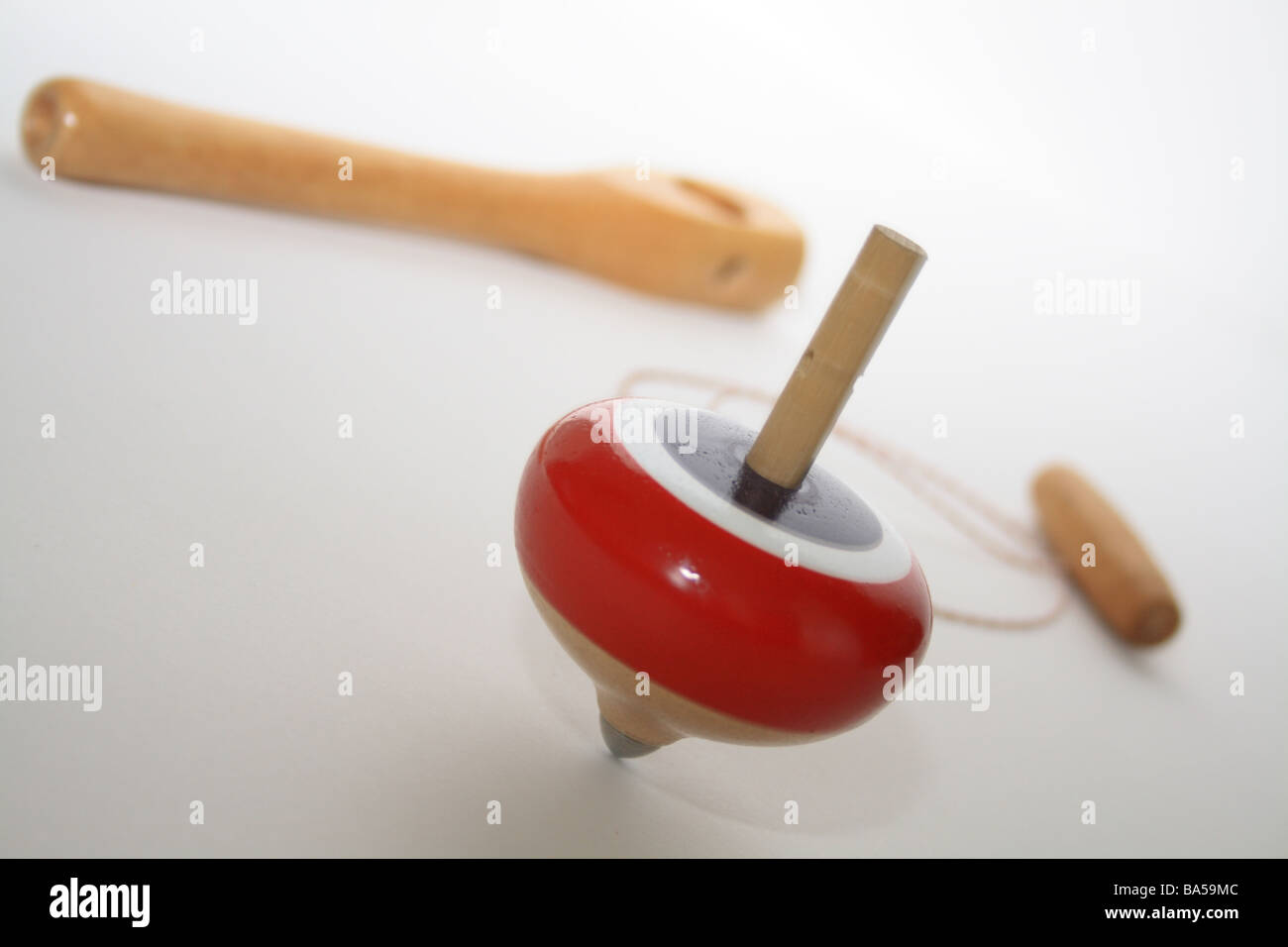 red, white and blue brightly coloured spinning top and string toy Stock ...