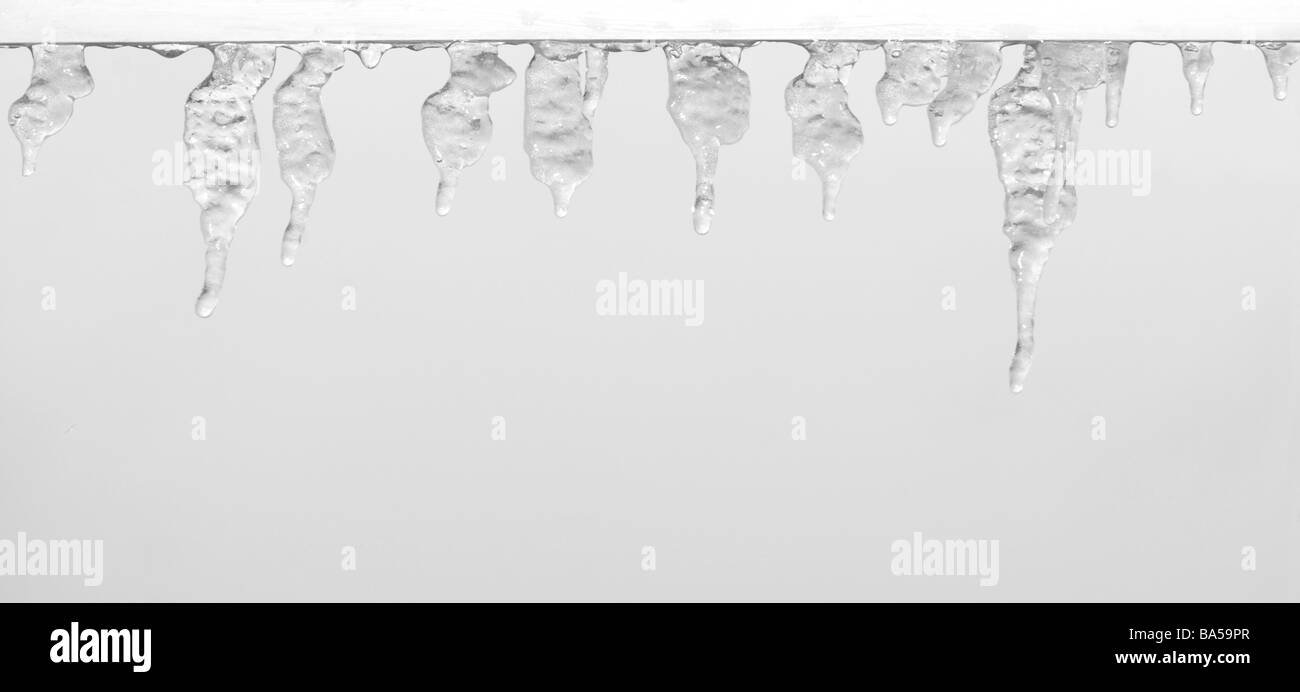 Small icicles hanging from an edge Stock Photo - Alamy