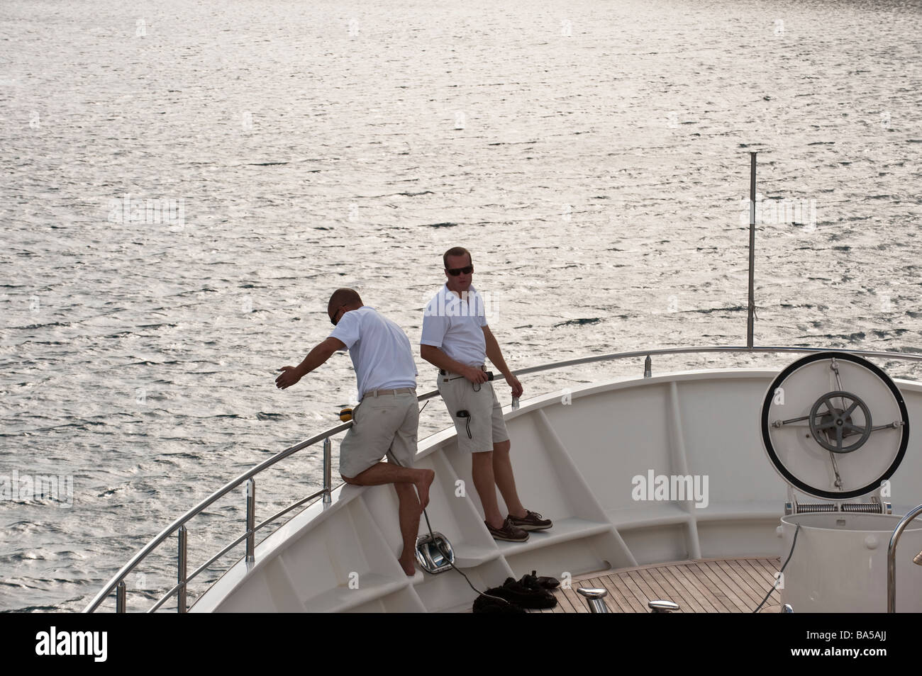 Raising the anchor aboard super yacht "Big Aron", one of the deckhands ...