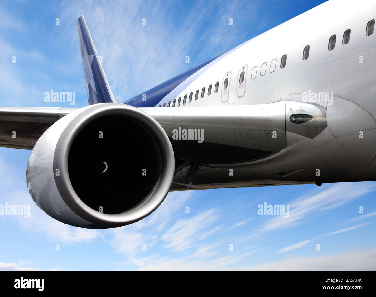 A close up of a passenger airplane in the sky Stock Photo - Alamy