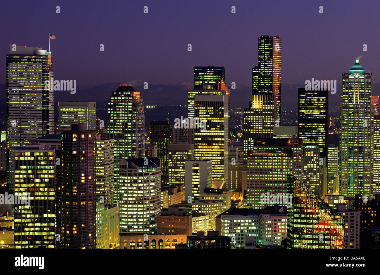 Retro image of Seattle skyline illuminated at dusk with city lights ...