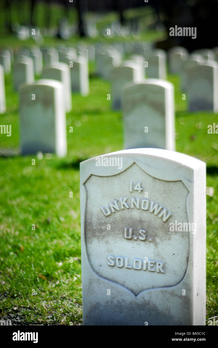A grave of an unknown soldier is one of many in the military section of ...