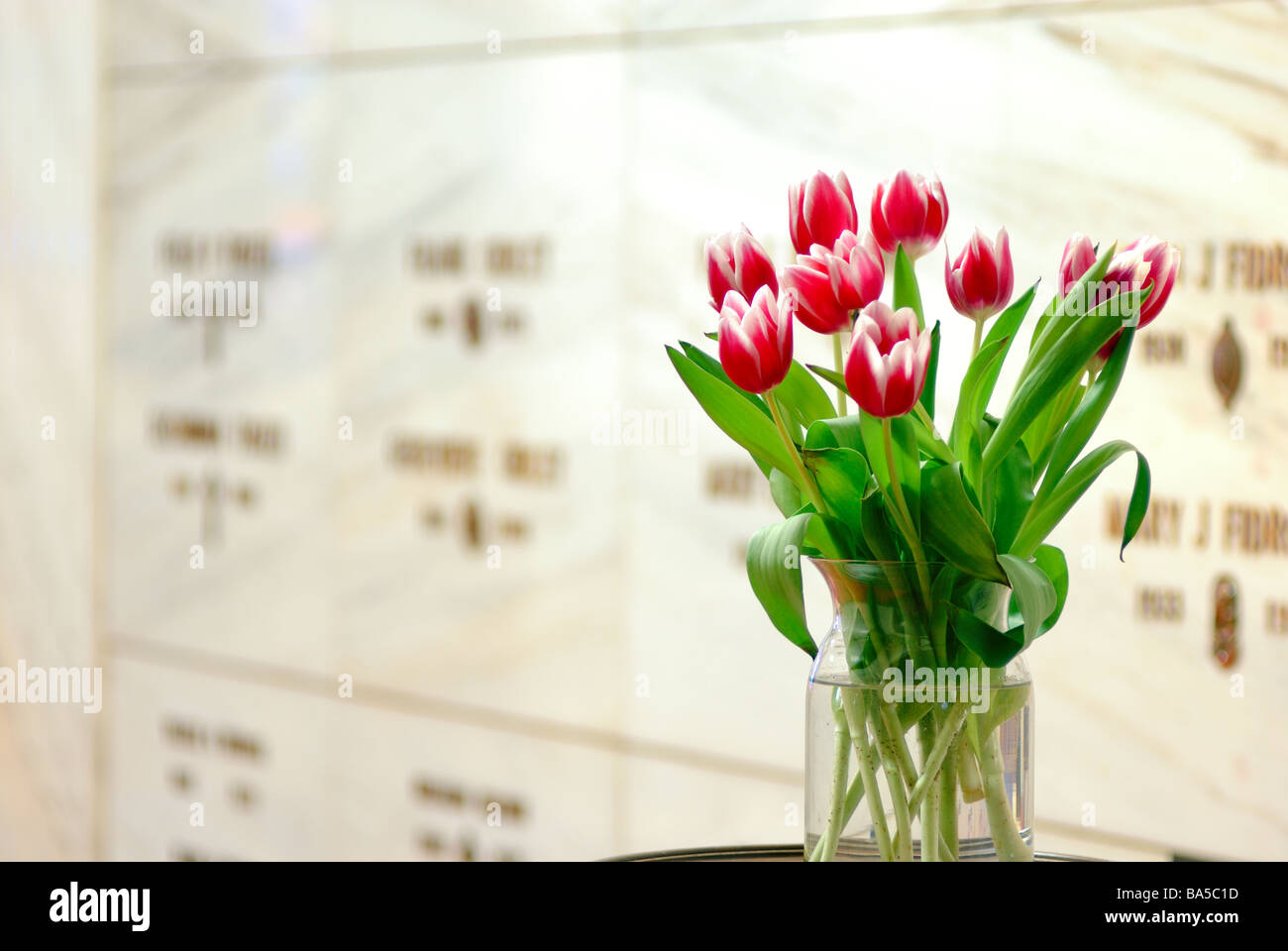 A flower arrangement left in memorium of a loved one in a mausoleum at ...