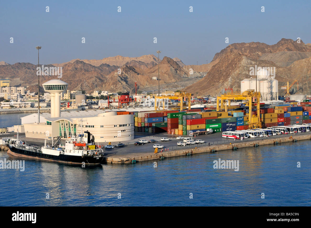 Coaches awaiting cruise ship passengers at Port Sultan Qaboos Muttrah ...