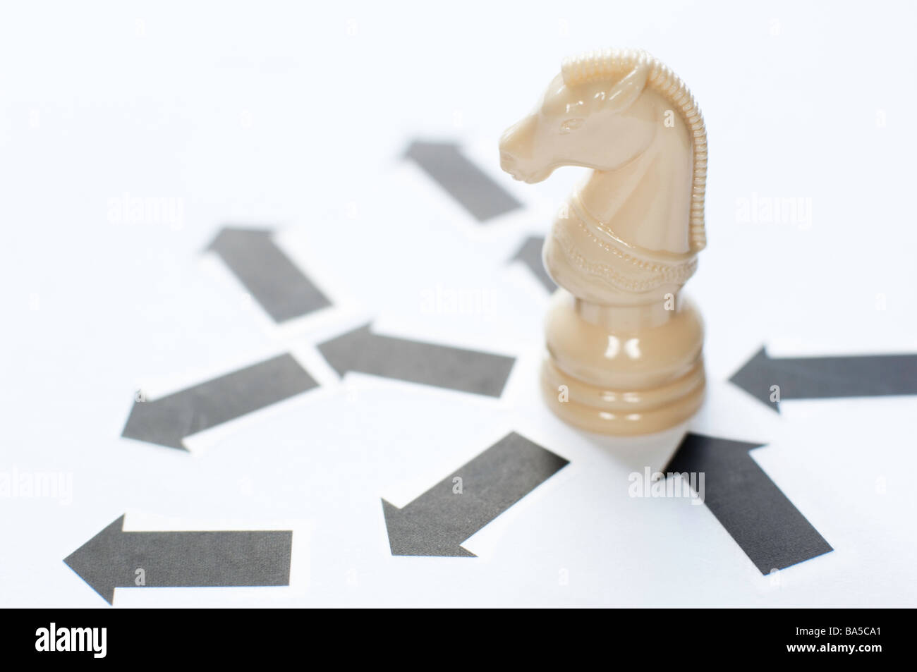 Knight chess piece amid arrows pointing different directions Stock ...