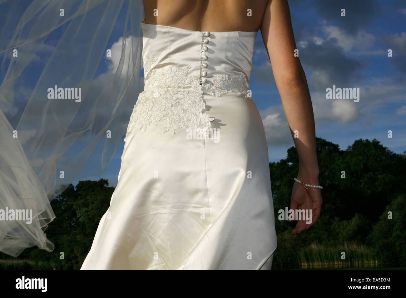 Bride in wedding dress, rear view Stock Photo - Alamy