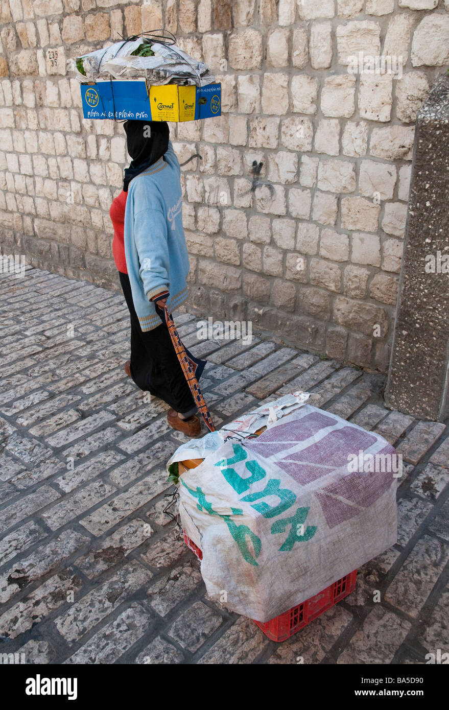 Old woman carrying heavy load hi-res stock photography and images - Alamy