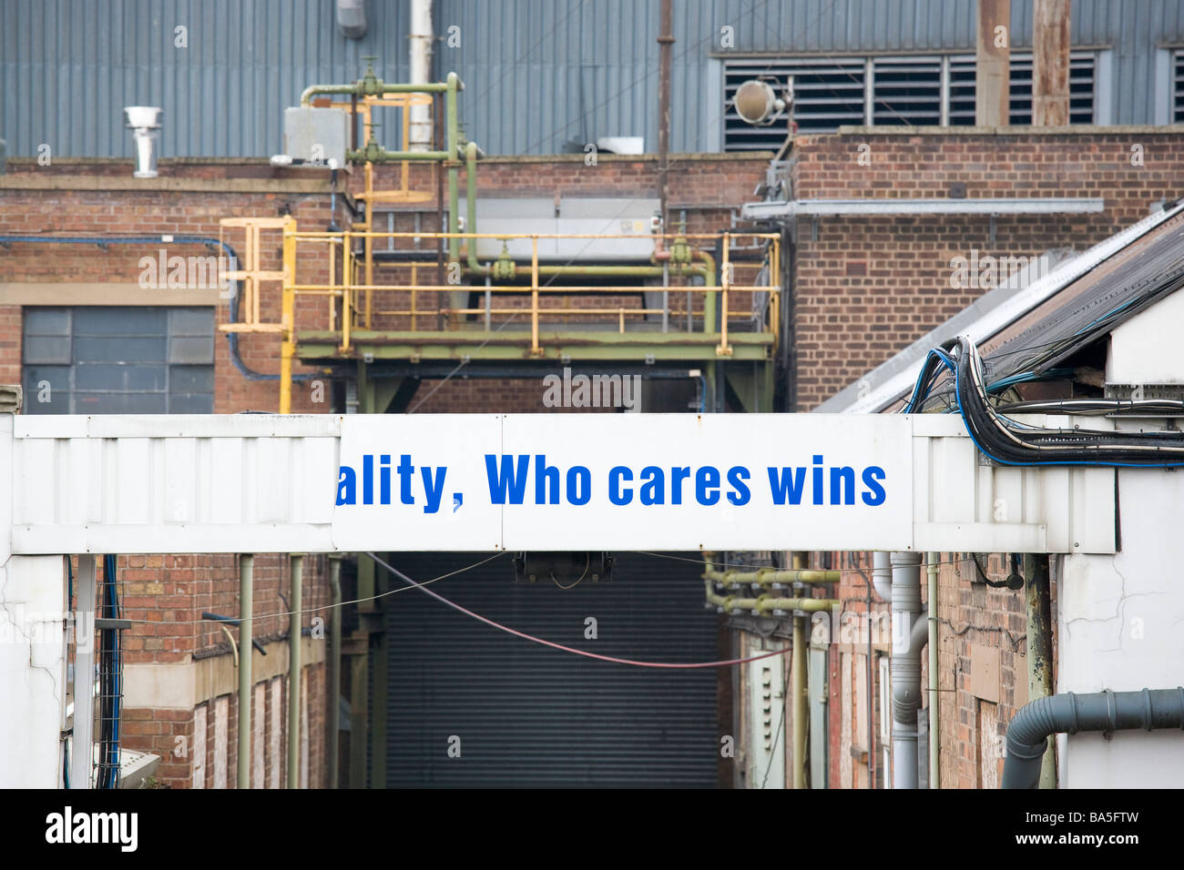 Closed and abandoned Ford factory with a broken "Quality - Who cares ...