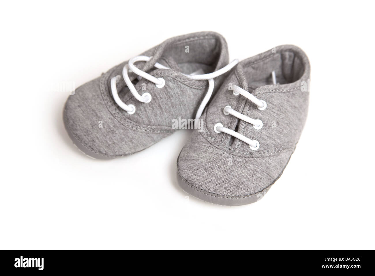 Babies shoes isolated on a white studio background Stock Photo - Alamy