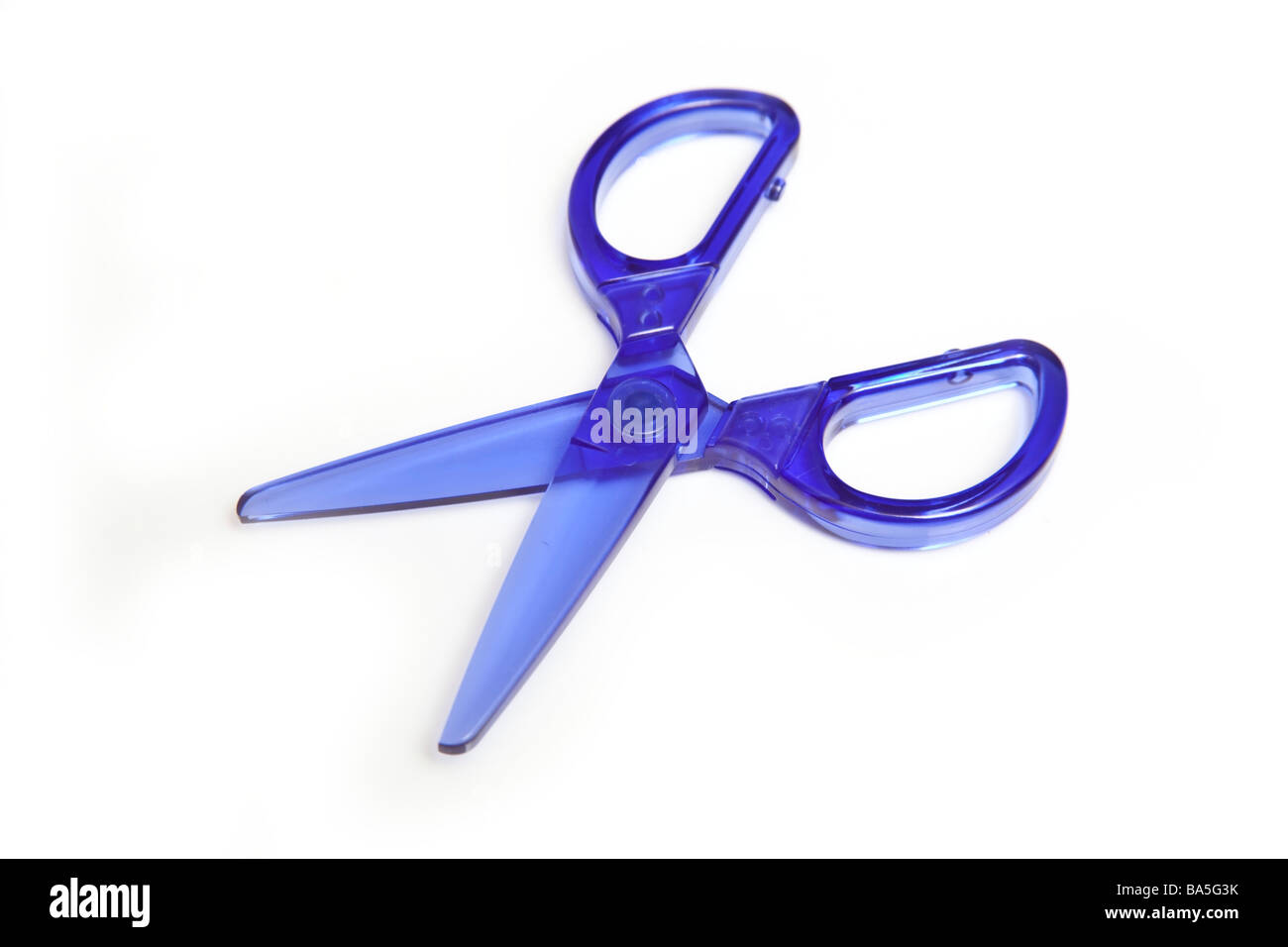Plastic kids safety scissors isolated on a white studio background ...