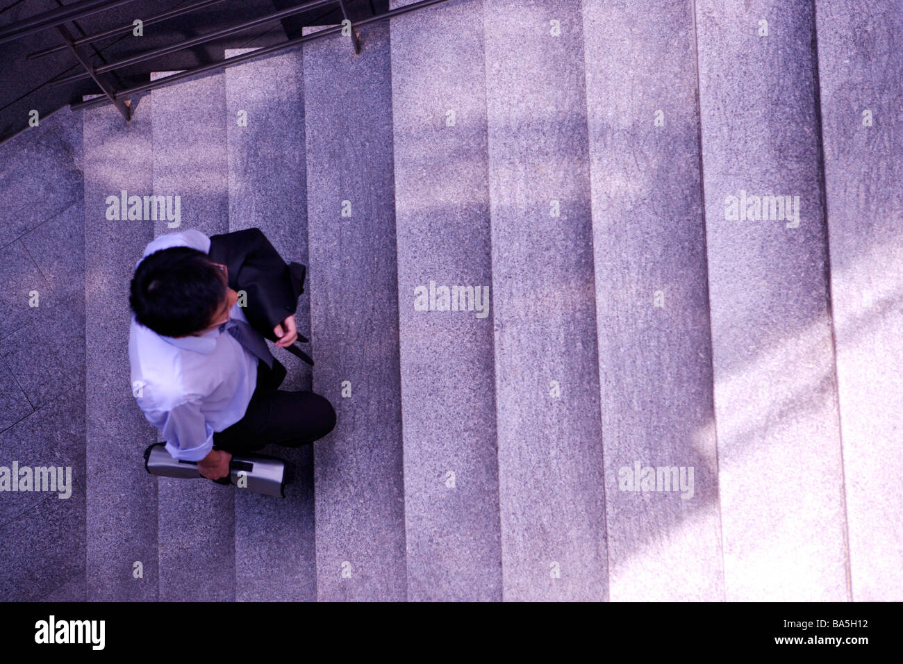 Businessman climbing stairs overhead view Stock Photo - Alamy