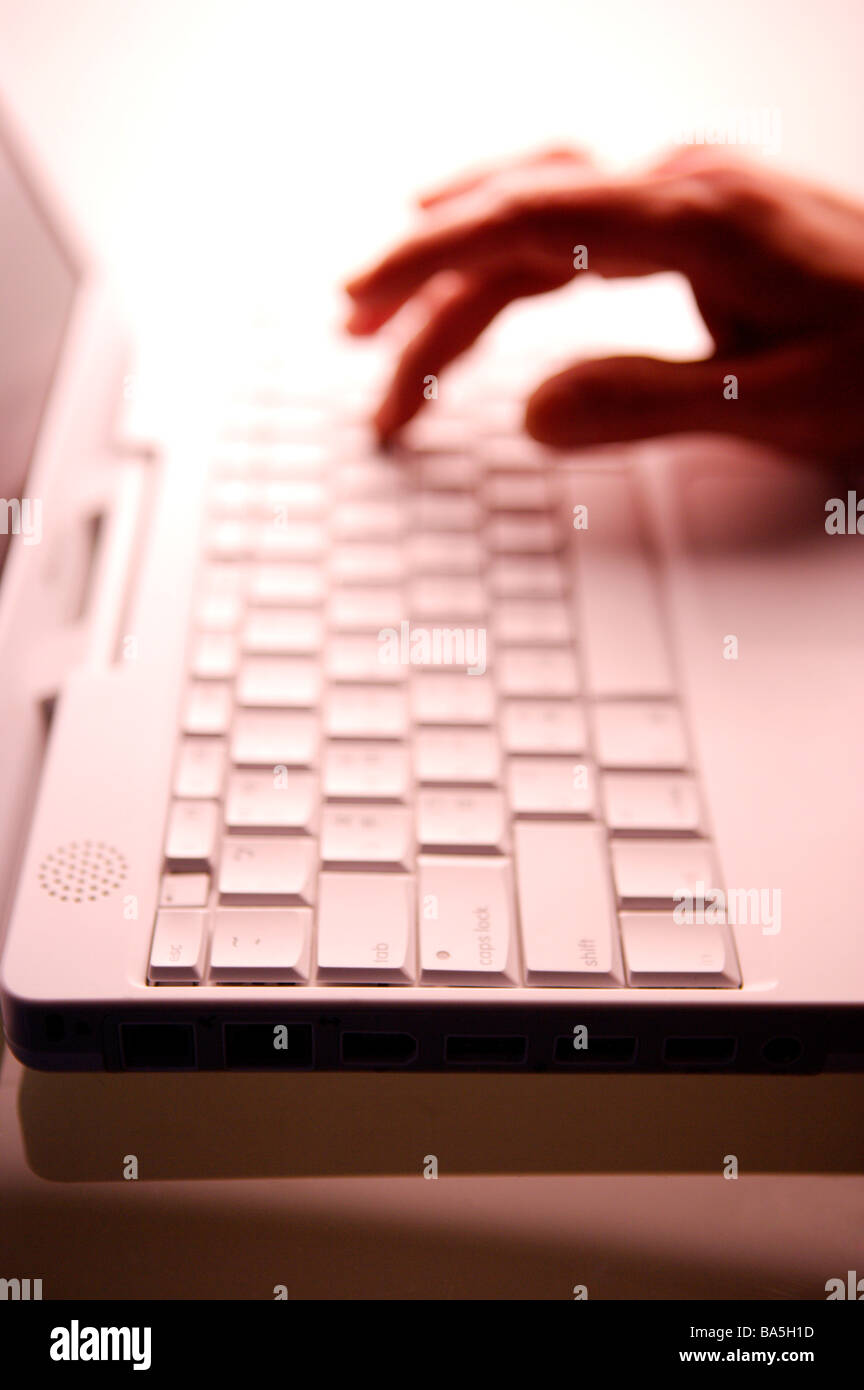 Man s hand on laptop typing Stock Photo - Alamy