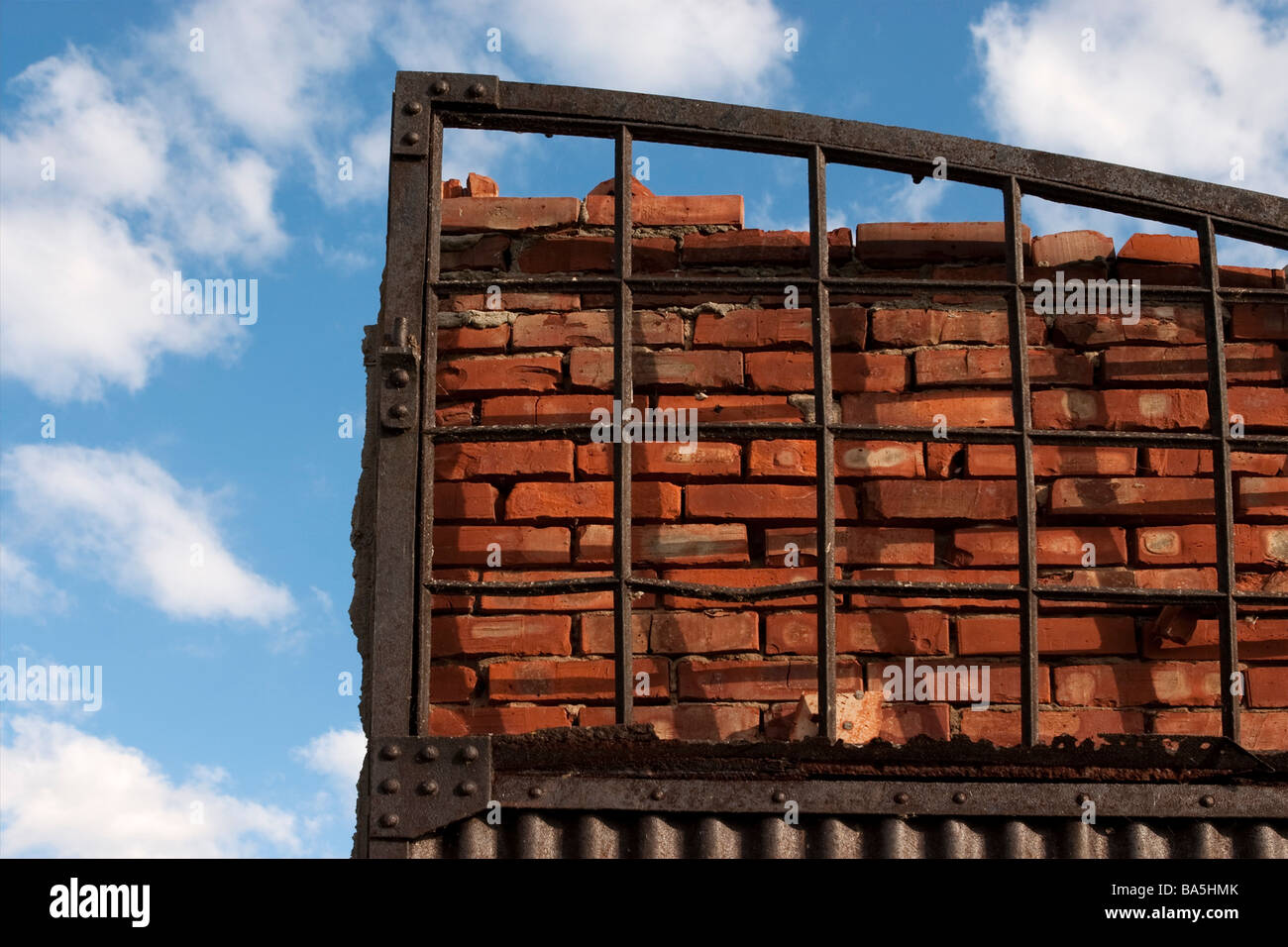 View of parly destroyed piled up gates Stock Photo - Alamy
