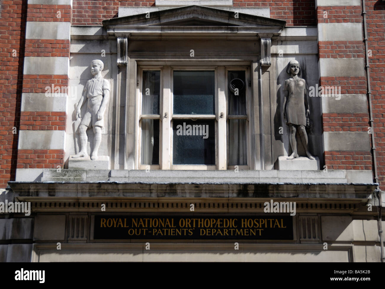 Statues of boy and girl on exterior of the Royal National Orthopaedic ...