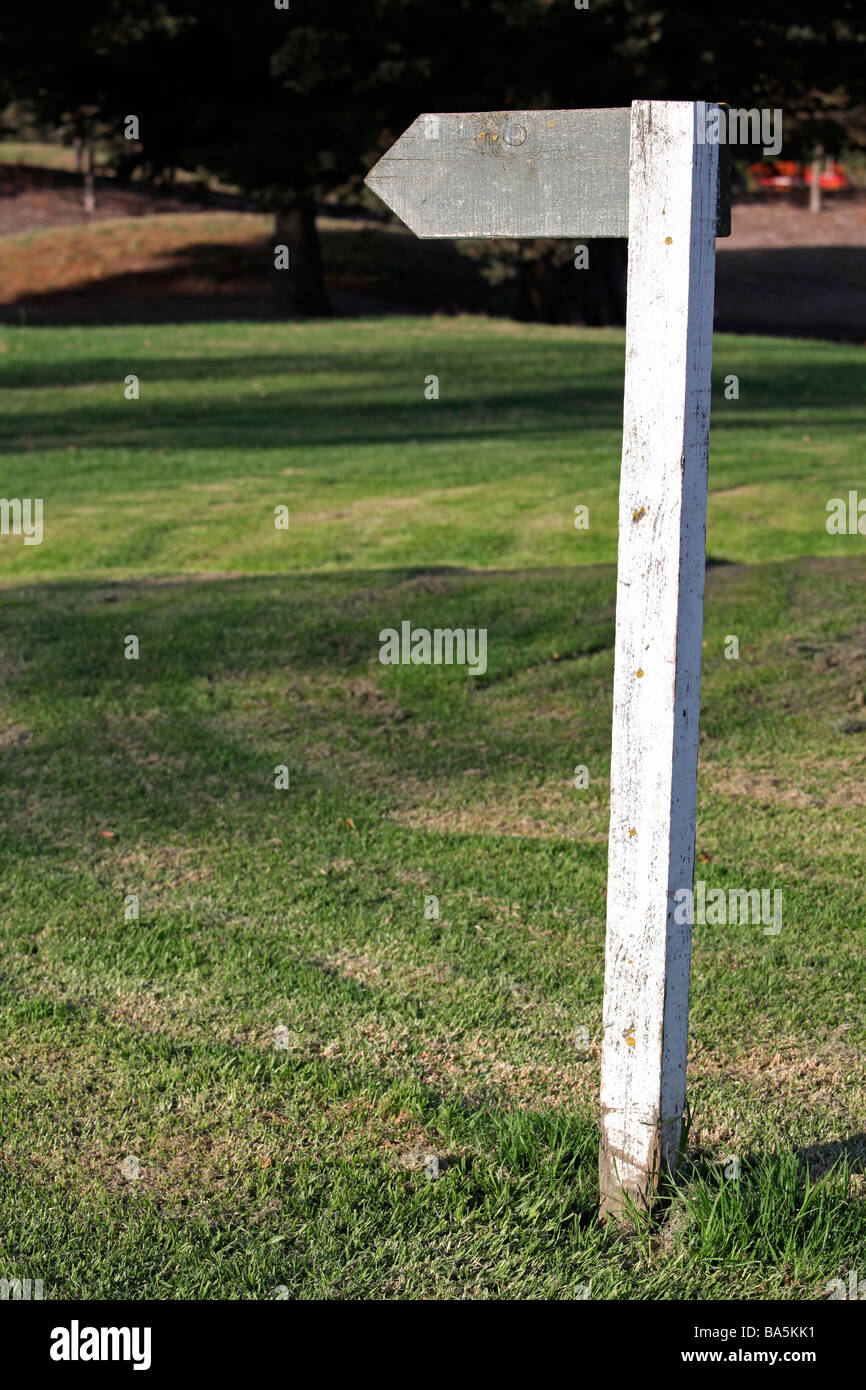Signpost on golf course Stock Photo - Alamy