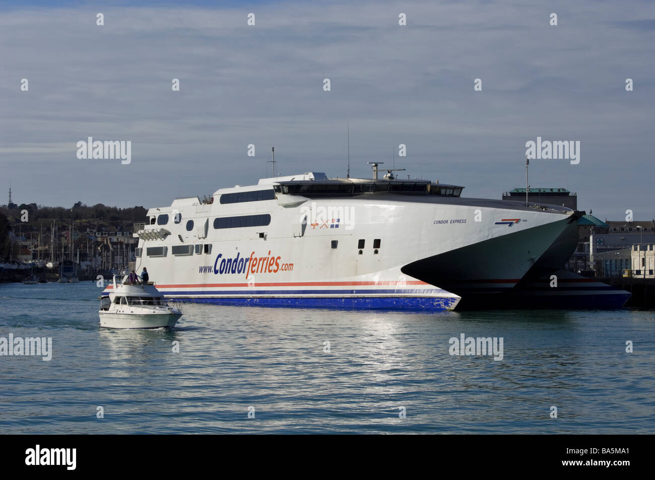 Condor Express catamaran moored at the entrance to Weymouth Harbour in ...