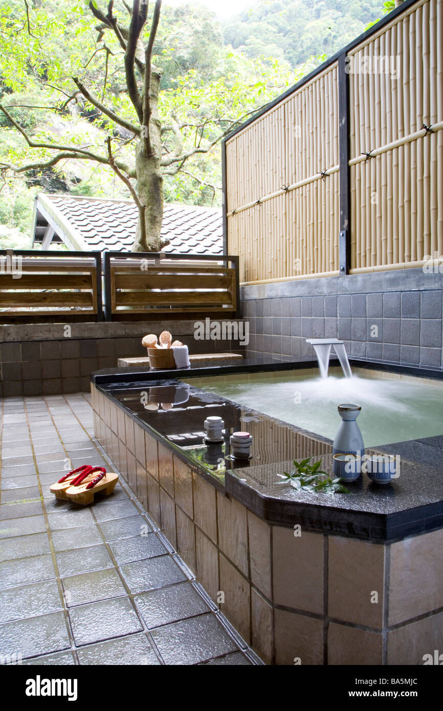 Sake bucket and clogs by pool Stock Photo - Alamy