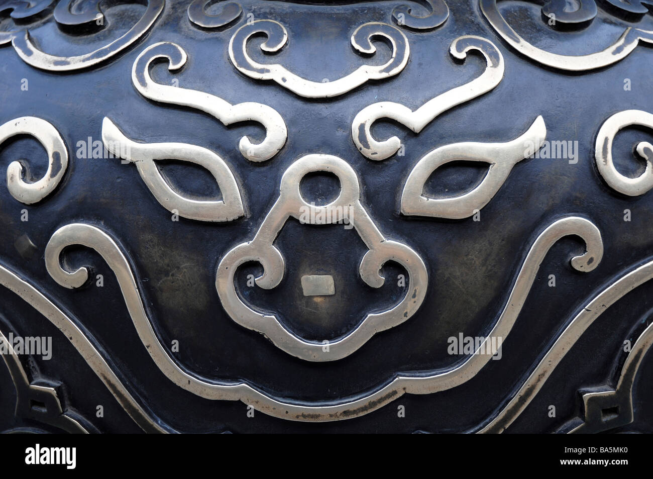 Chinese pot decoration that looks like a face Stock Photo - Alamy