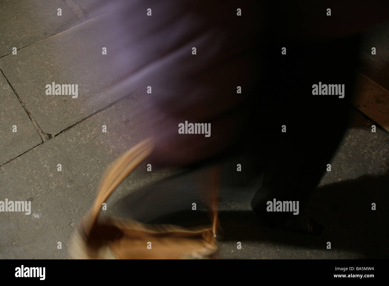 one person walking on city street pavement at night Stock Photo - Alamy