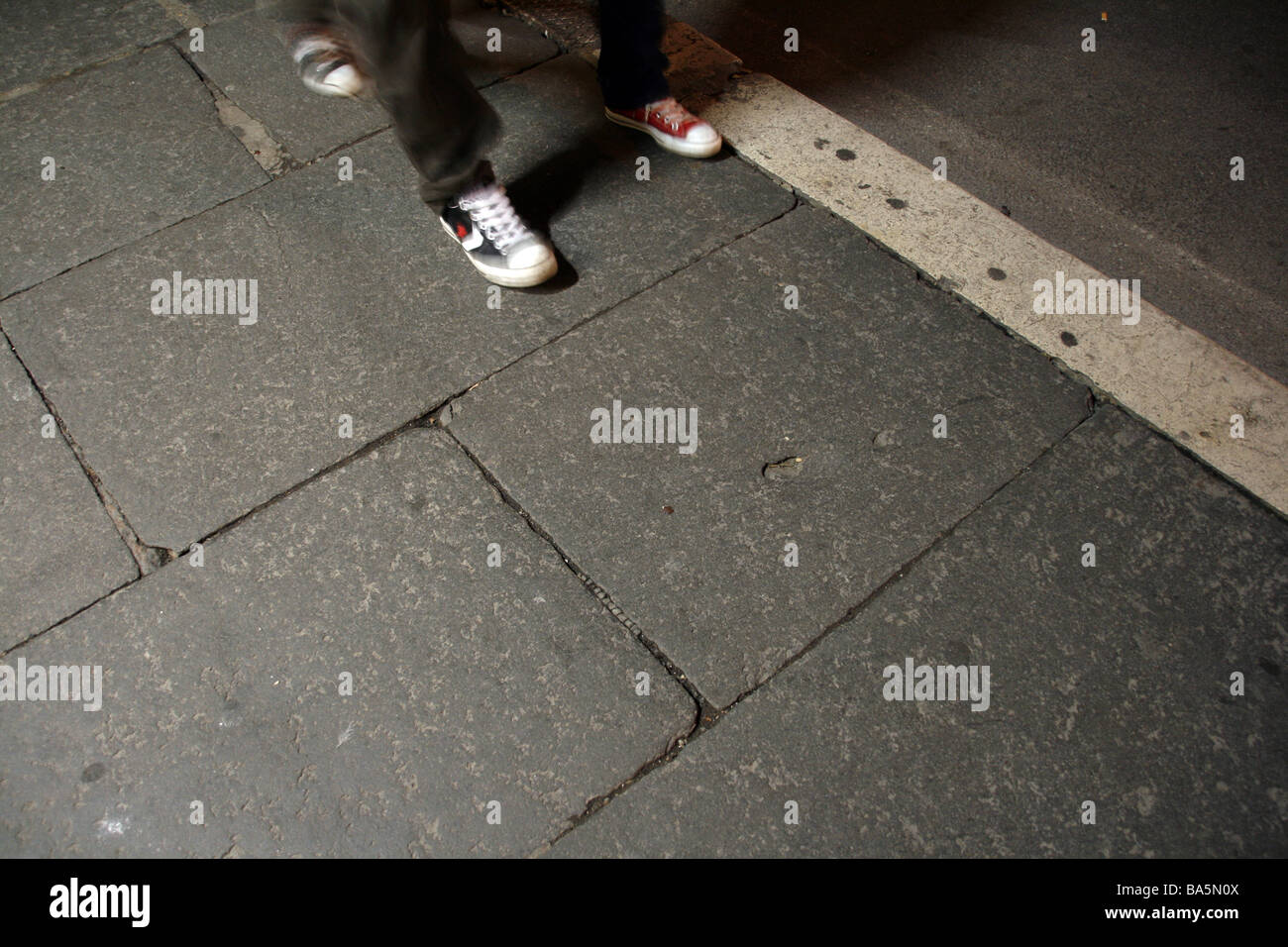 people walking on city street pavement at night Stock Photo - Alamy