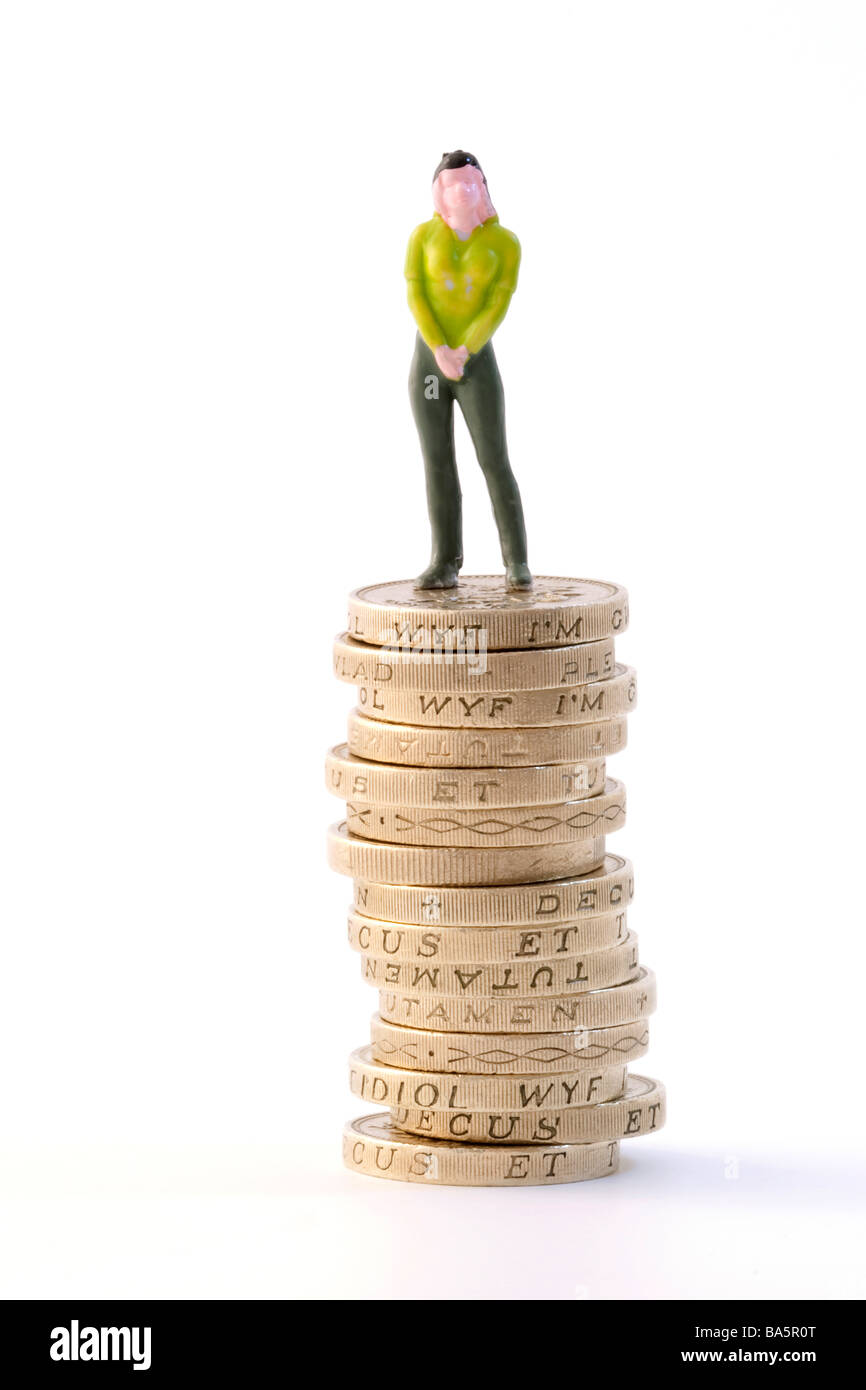 model of woman standing on pile of one pound coins Stock Photo - Alamy