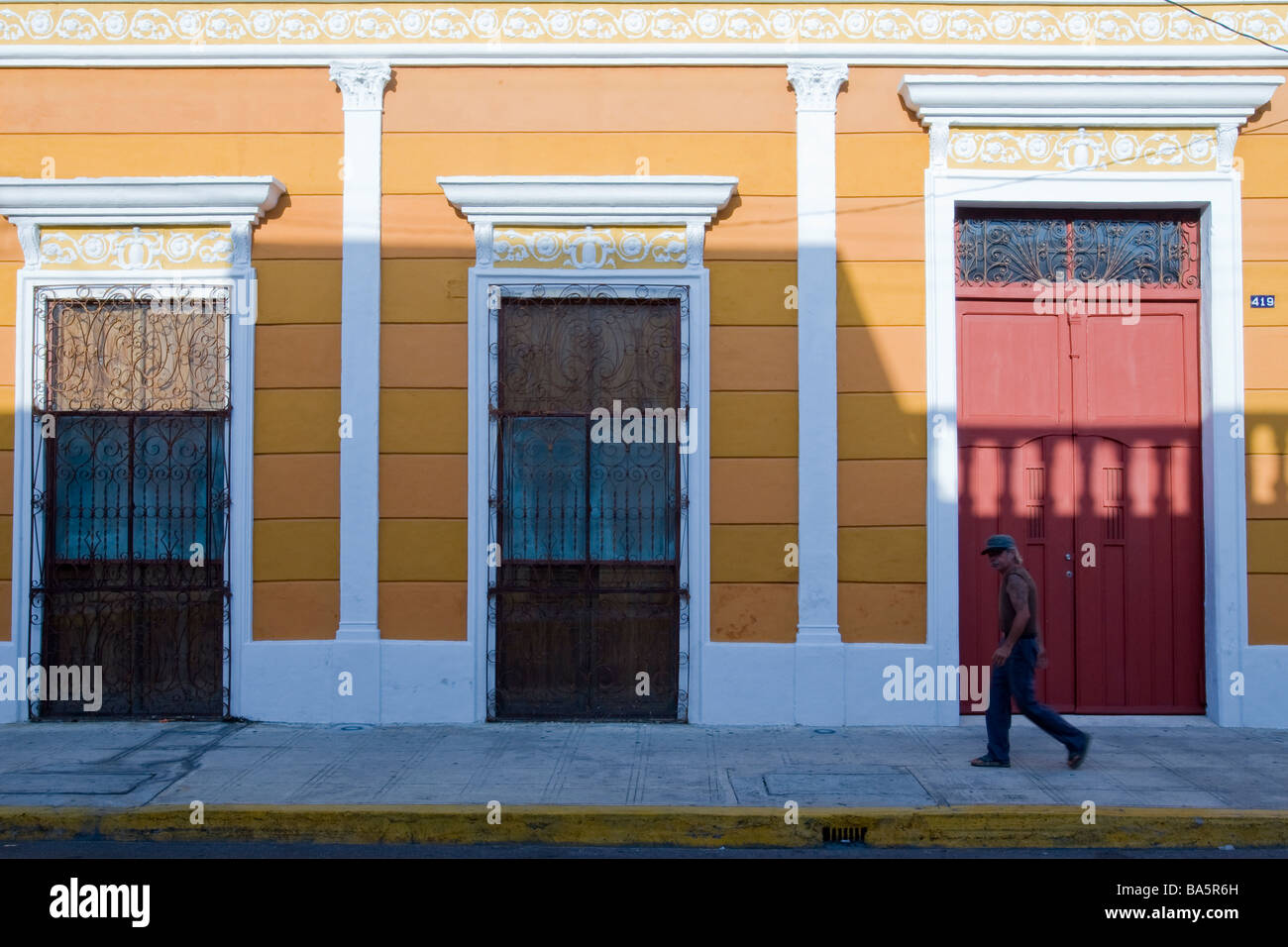 A man walking on the street in Merida Mexico Stock Photo - Alamy
